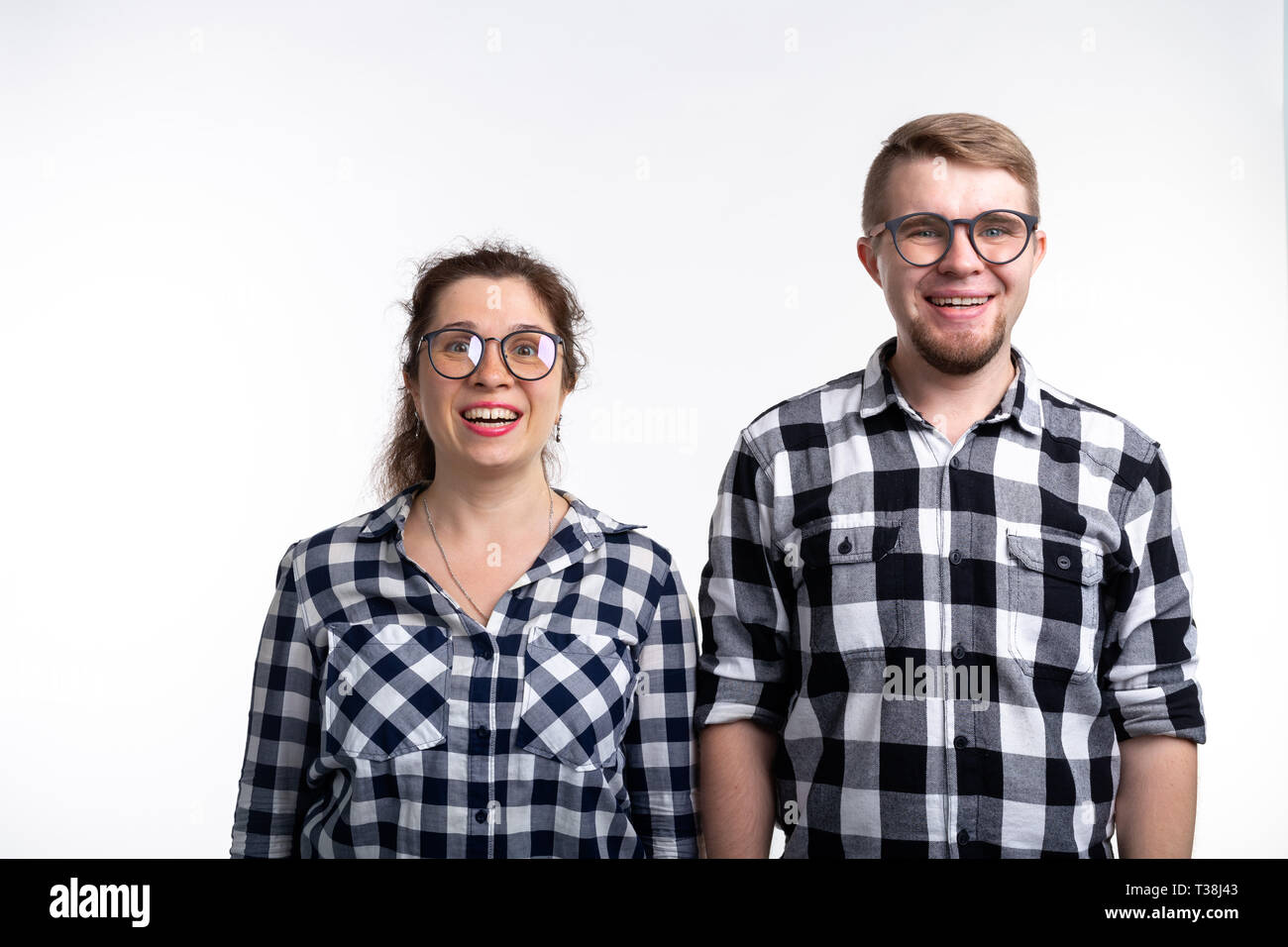 Nerds, bespectacled and funny people concept - funny couple in glasses ...