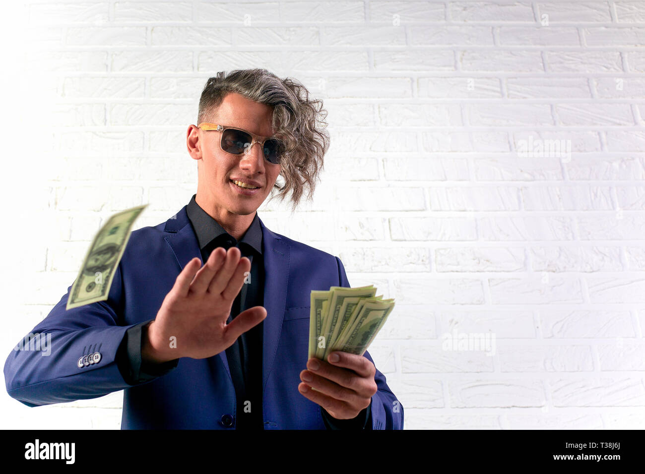 Businessman throwing money on white background. Man in suit wear ...