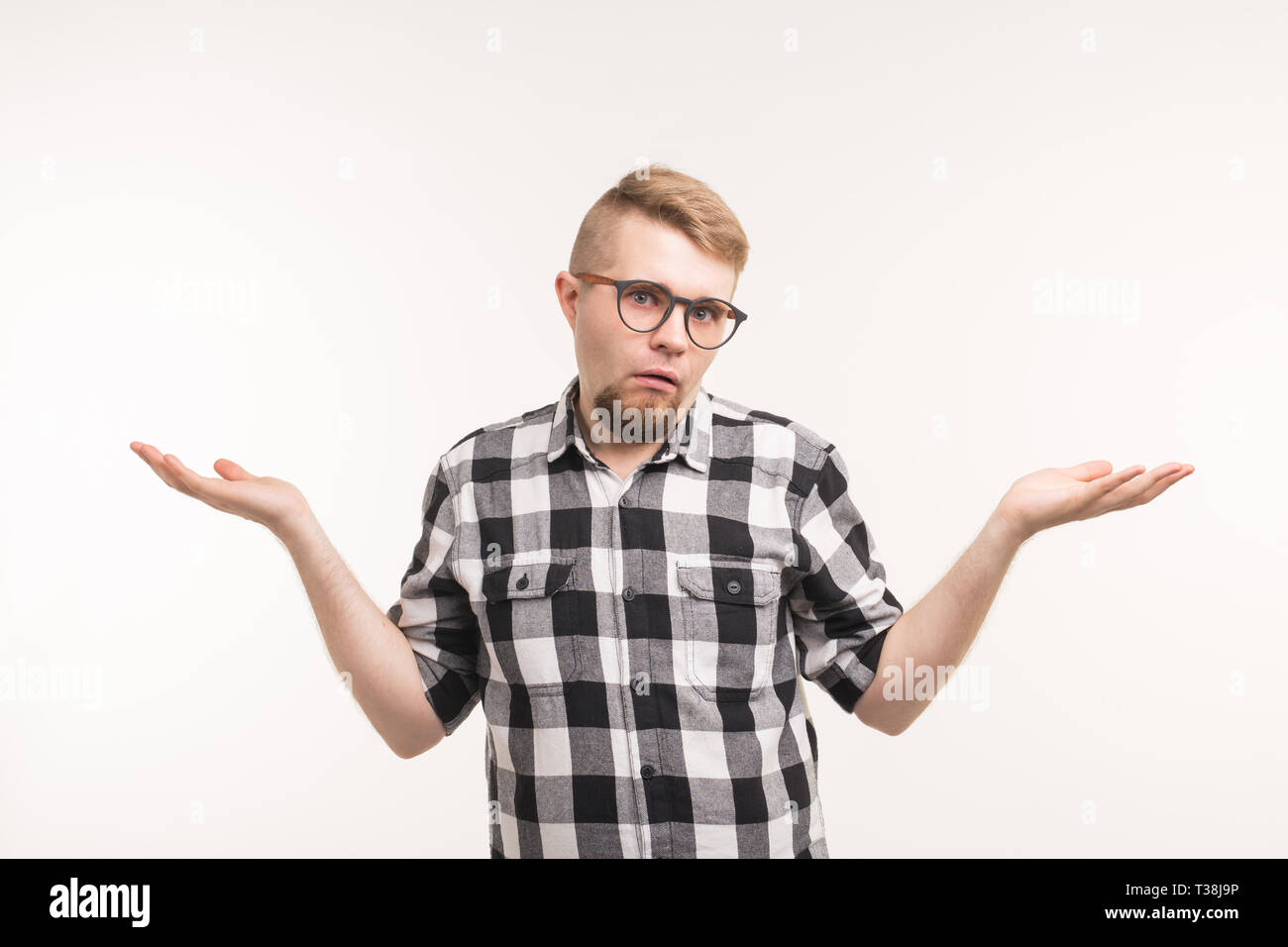 People, emotions and education concept - Student man gesturing shrug ...