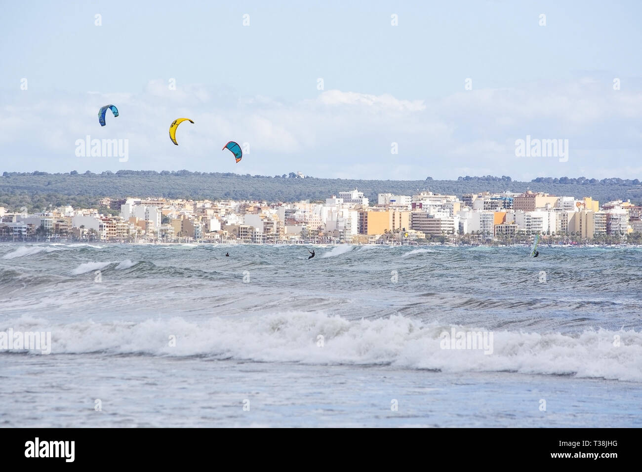 CAN PASTILLA, MALLORCA, SPAIN - APRIL 6, 2019: Surfers play in the ...