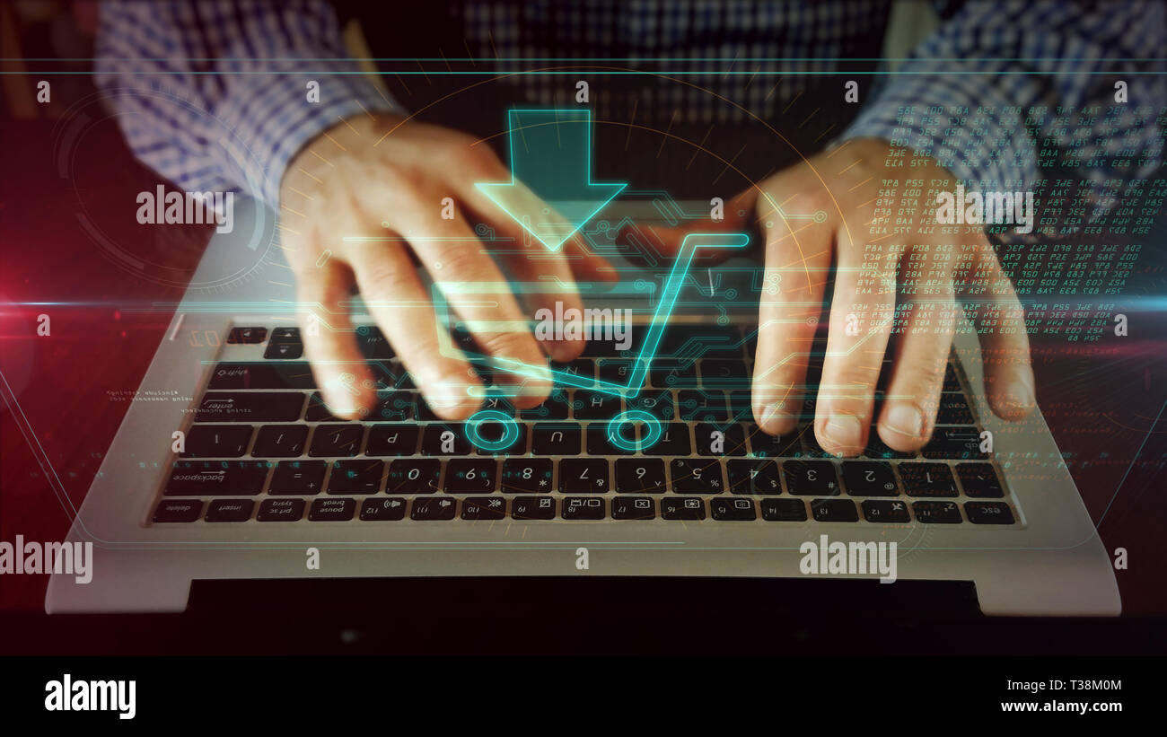 Man typing on laptop keyboard with online cart on hologram screen ...