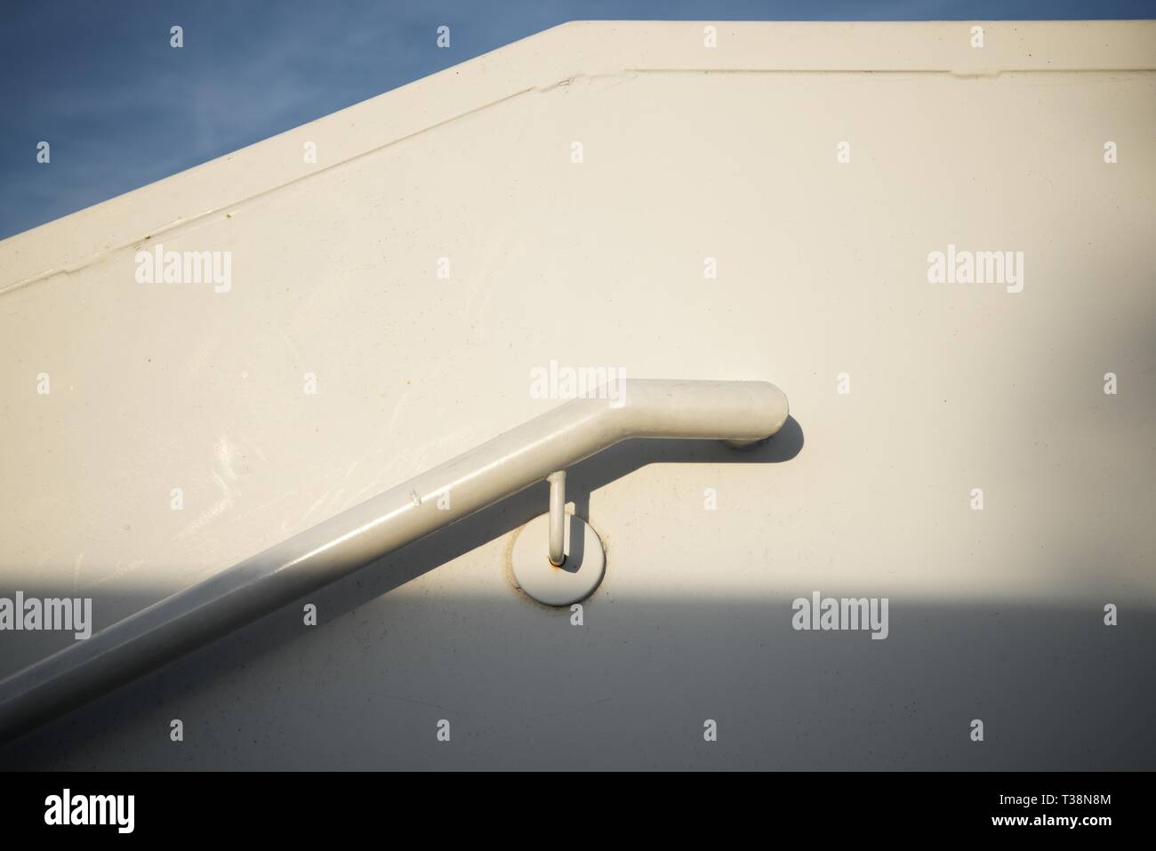 Metal railing on a concrete wall Stock Photo - Alamy