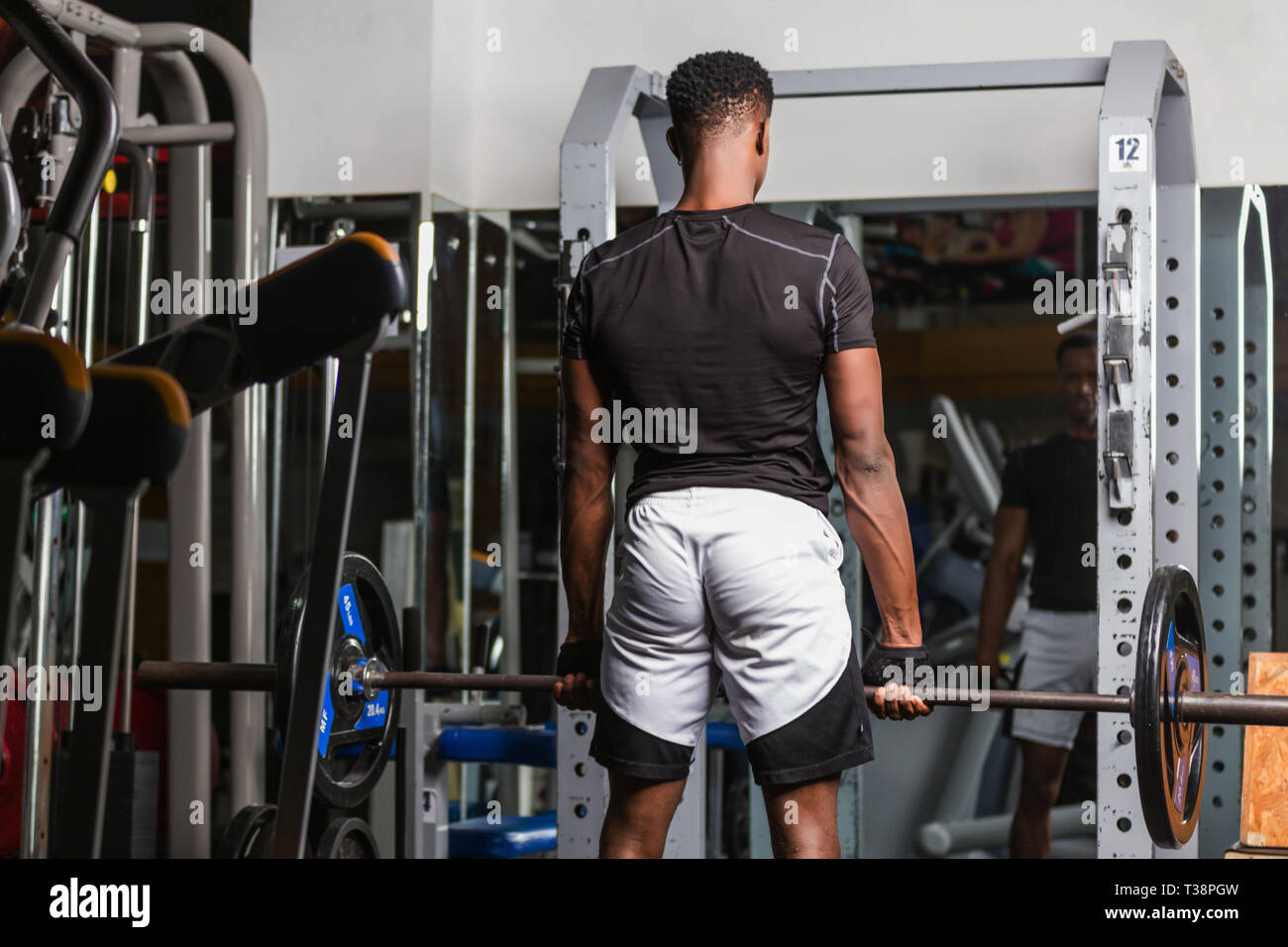 Black African American young man doing workout at the gym Stock Photo ...