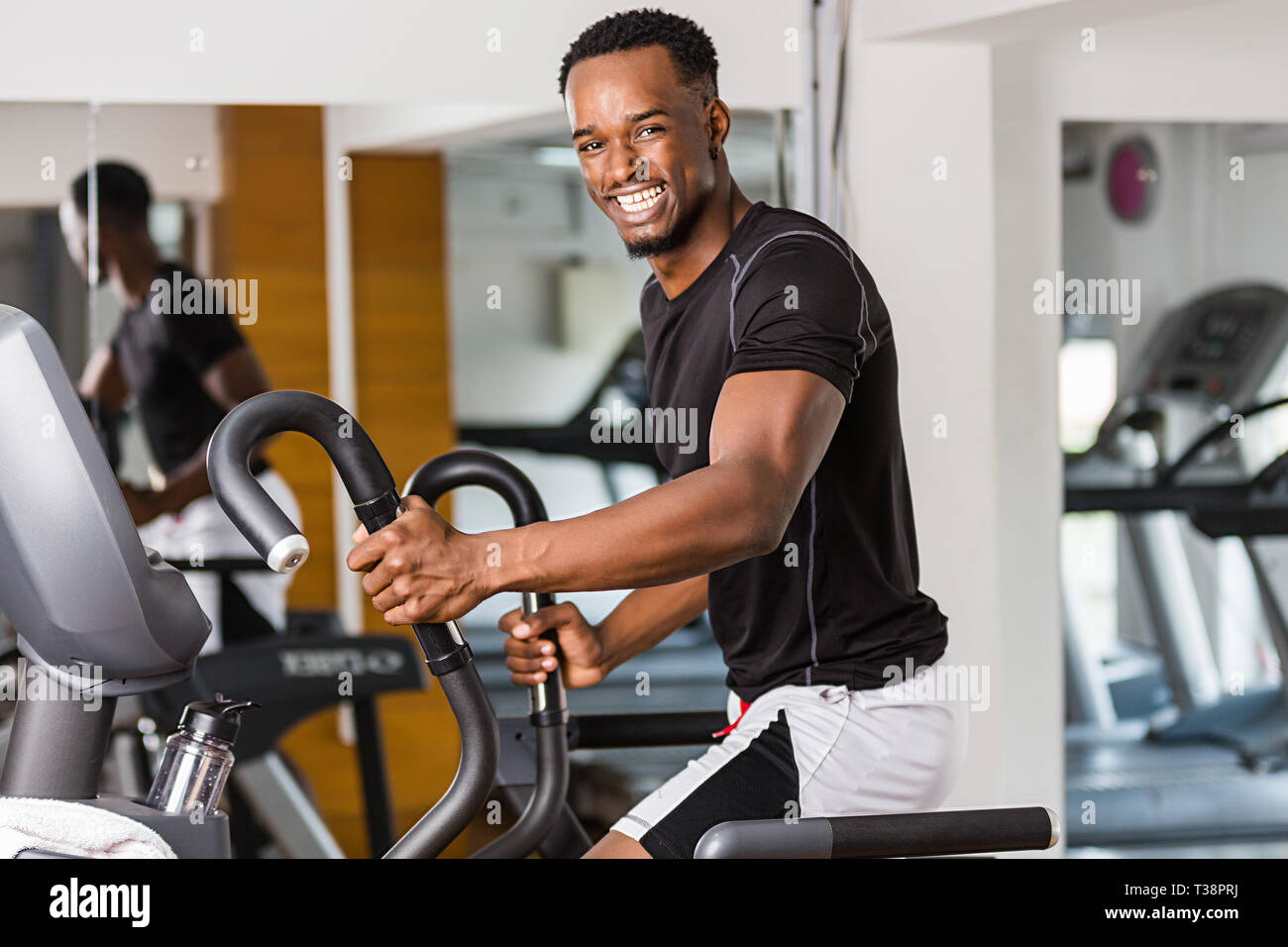 Black African American young man doing cardio workout at the gym Stock ...