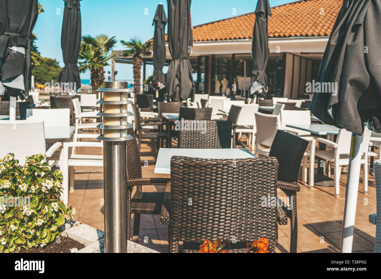 Decorative lights along the street cafe-barrier. Front street cafe ...