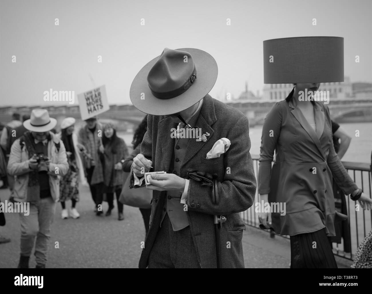Man hat on head Black and White Stock Photos & Images - Alamy