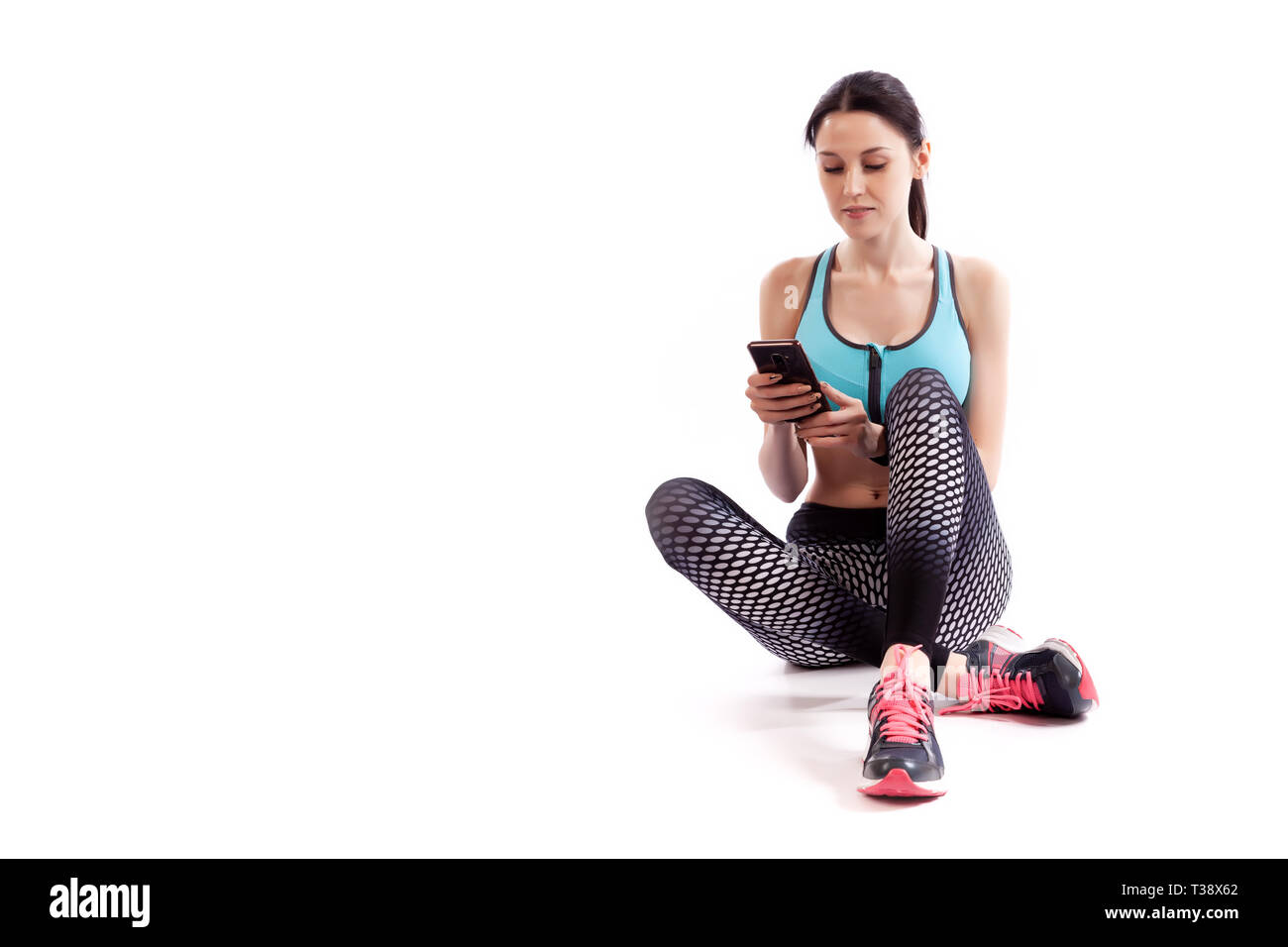 A sport woman model having break during jogging exercise, monitoring ...
