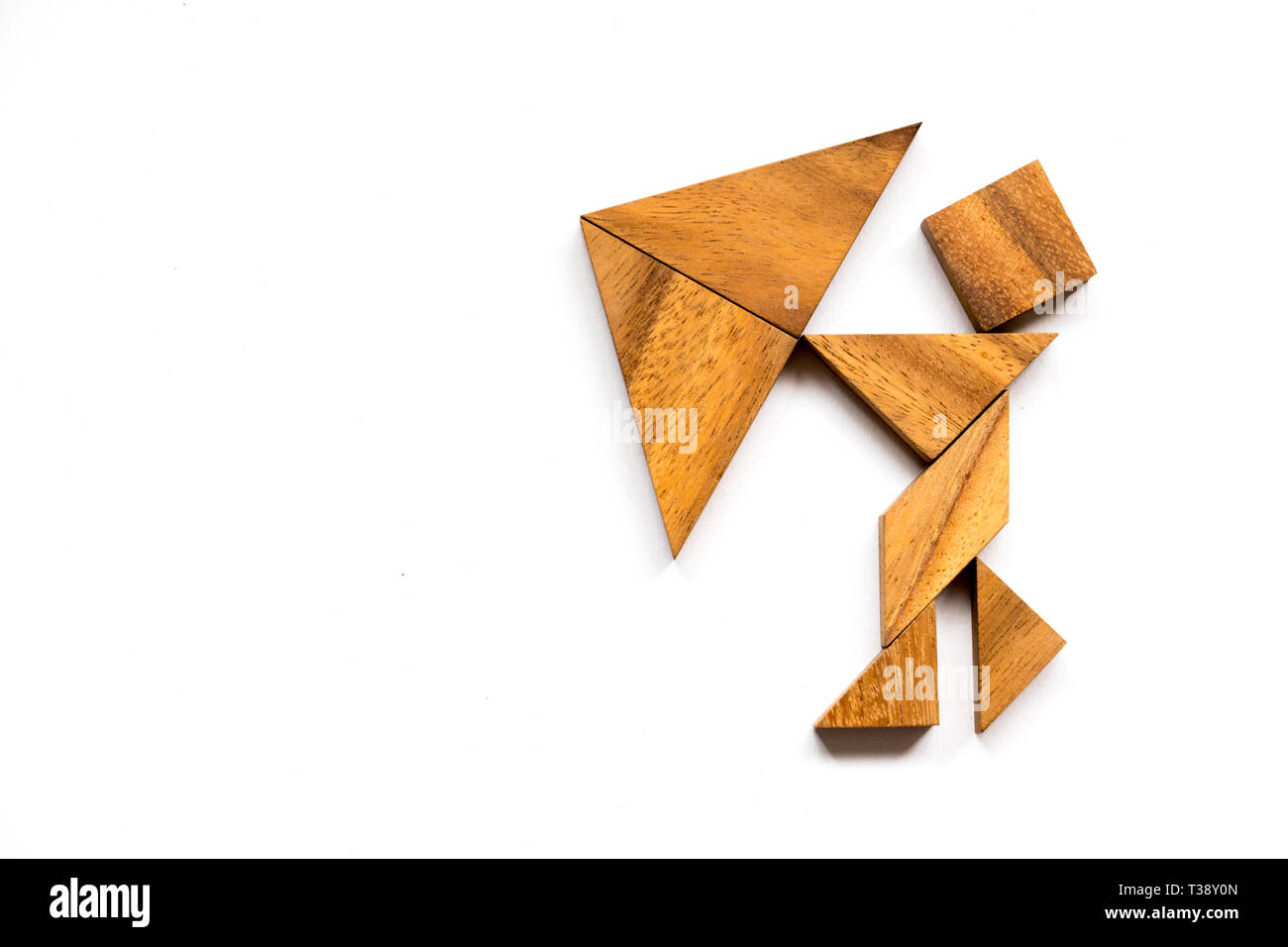 Wooden tangram as man hold umbrella shape on white background (Concept ...