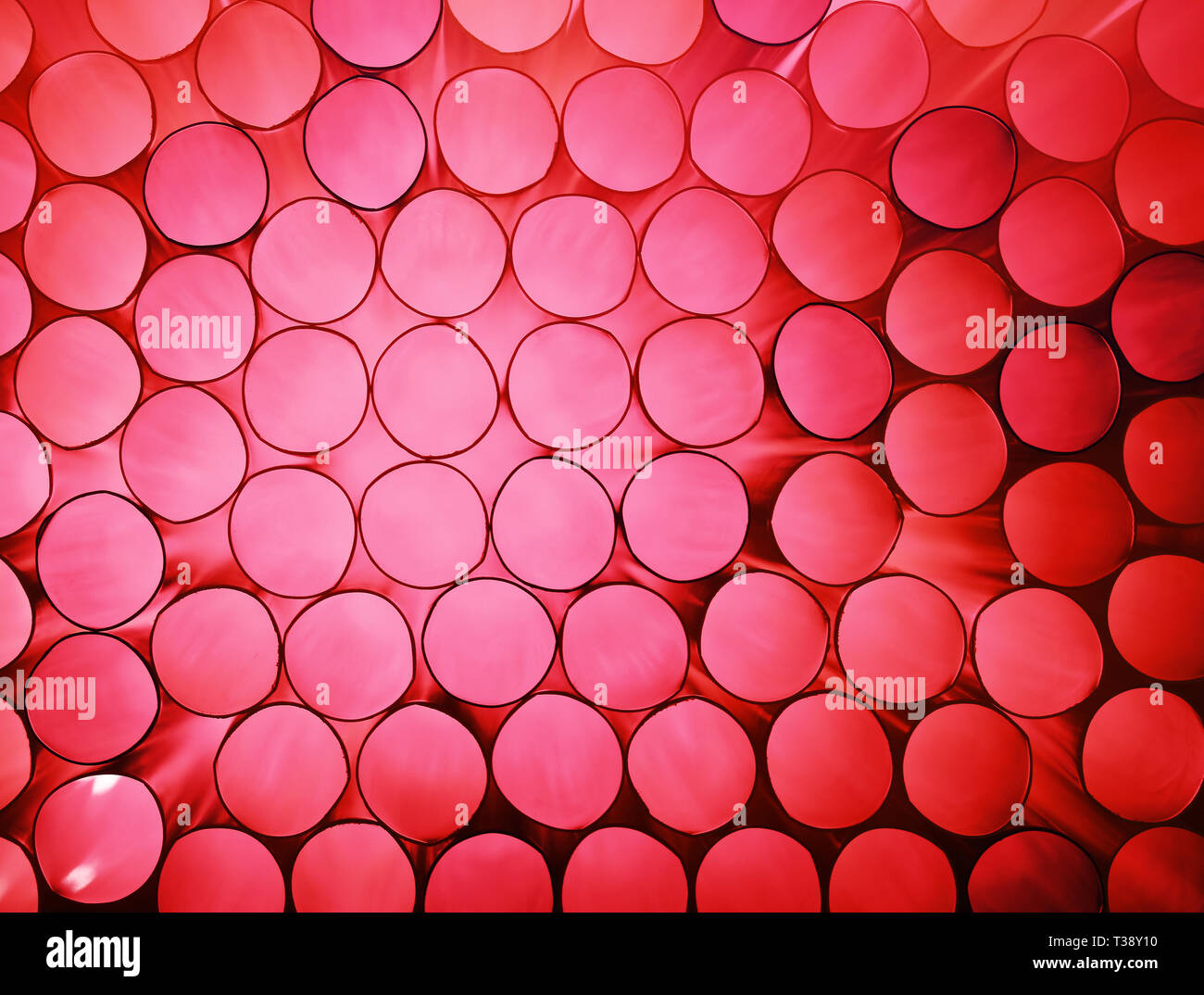 Abstract coral color toned pink background texture of backlit stack ...