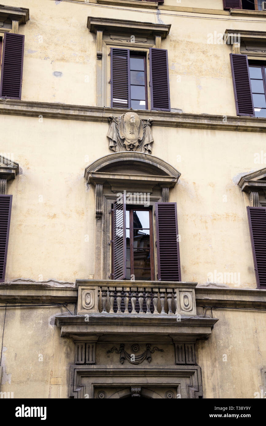 Arched pediment and heraldic shield over a balcony entrance, details of ...