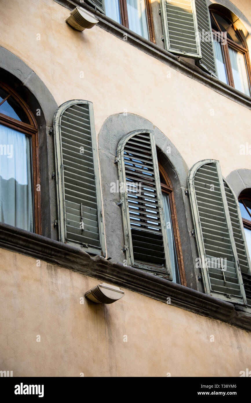 Arched Renaissance windows and shutters in Florence, Italy Stock Photo ...