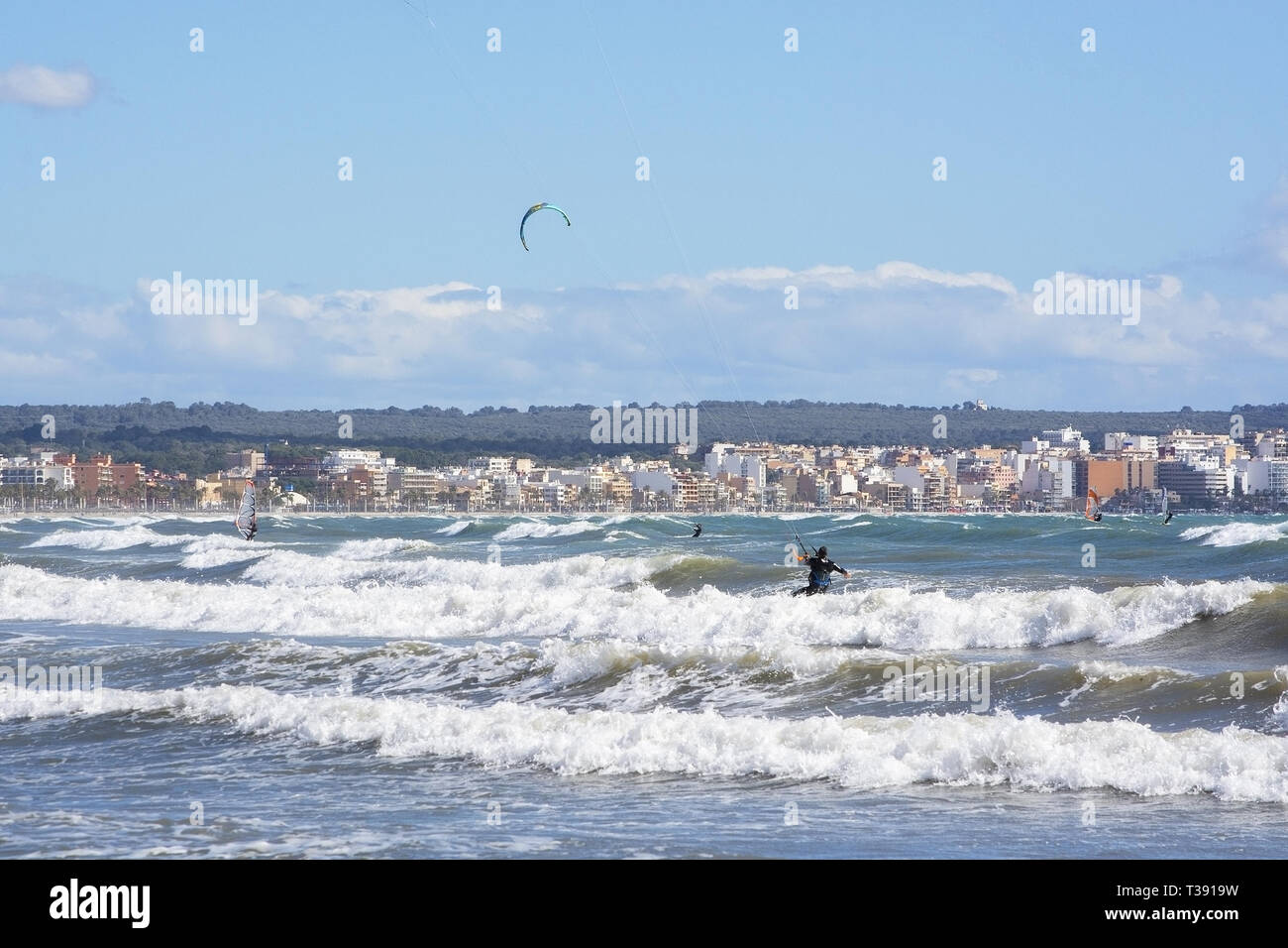 CAN PASTILLA, MALLORCA, SPAIN - APRIL 6, 2019: Surfers play in the ...