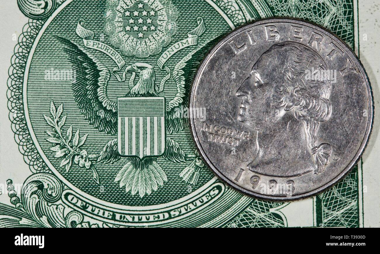 American quarter-dollar coin on a one dollar bill Stock Photo - Alamy