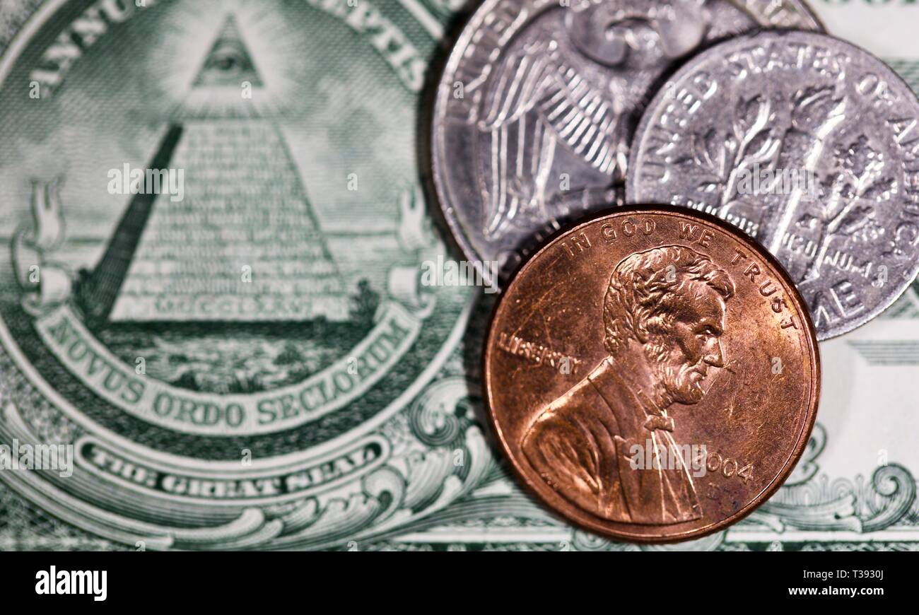 American coins on a one dollar bill Stock Photo - Alamy