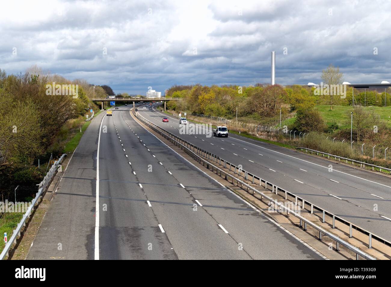 Elevated view of the M3 motorway with gathering storm clouds in the ...