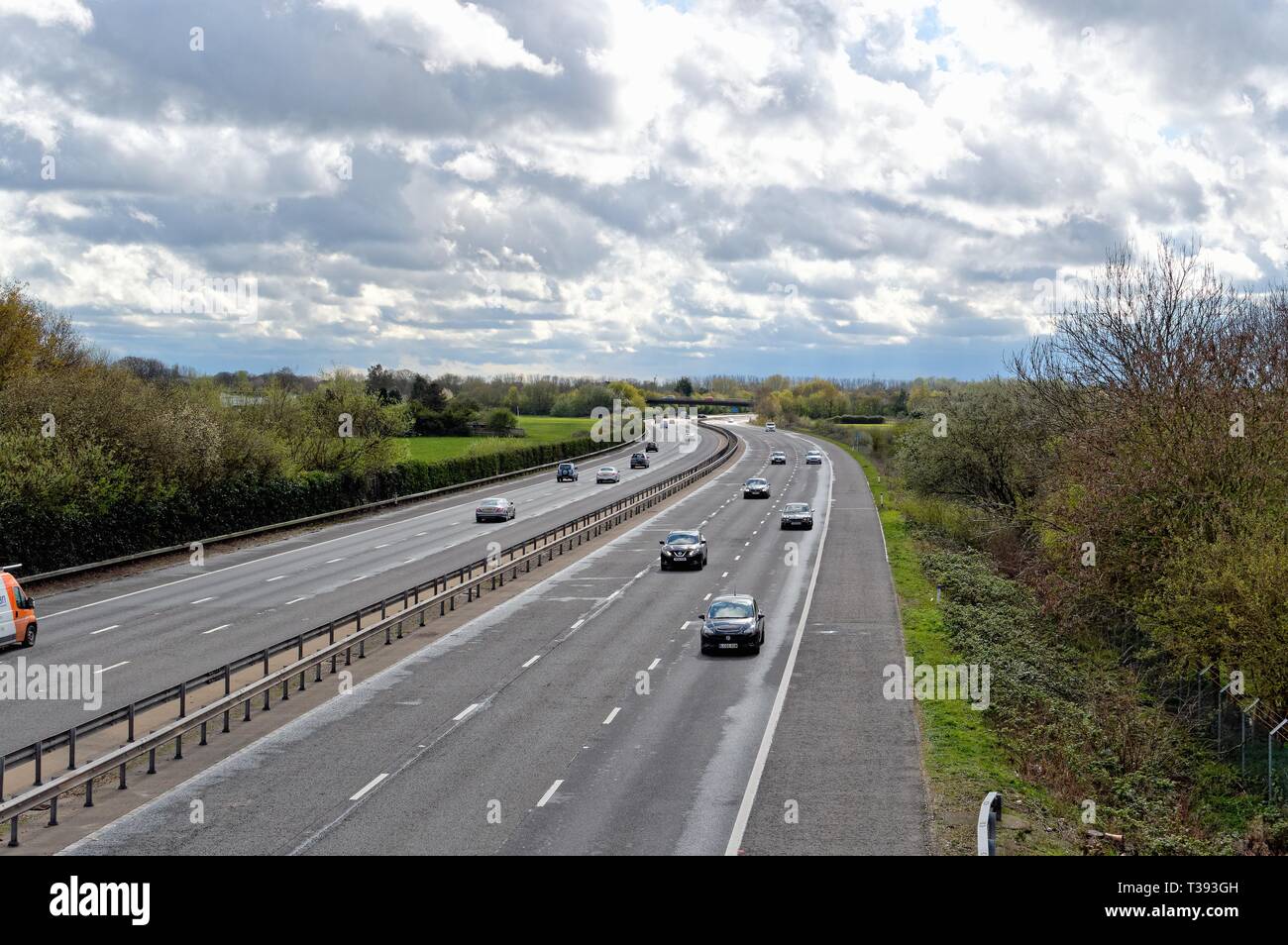 Elevated view of the M3 motorway with gathering storm clouds in the ...