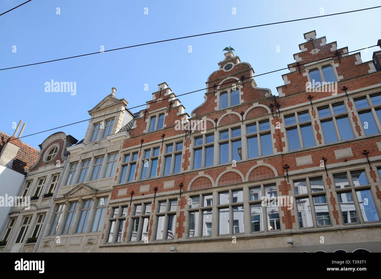 Facades of traditional brick buildings in Ghent, the capital of the ...