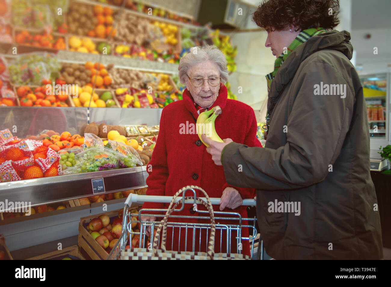 Helping an old woman hi-res stock photography and images - Alamy