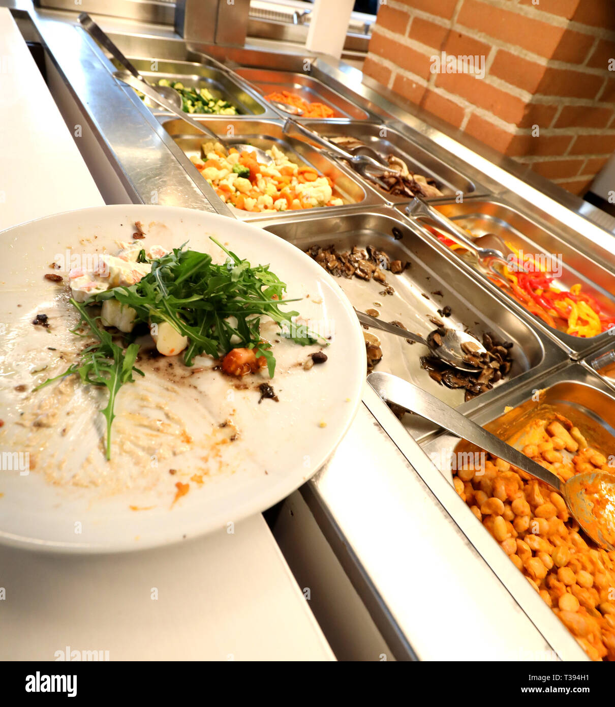 Inside a self service restaurant with many raw and cooked foods Stock ...