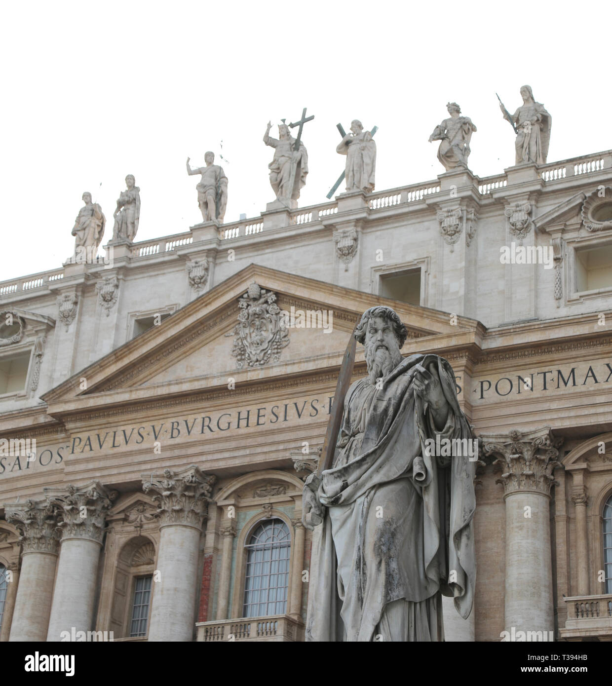 big statue of Saint Paul with sword and the Basilica of Saint Peter in ...