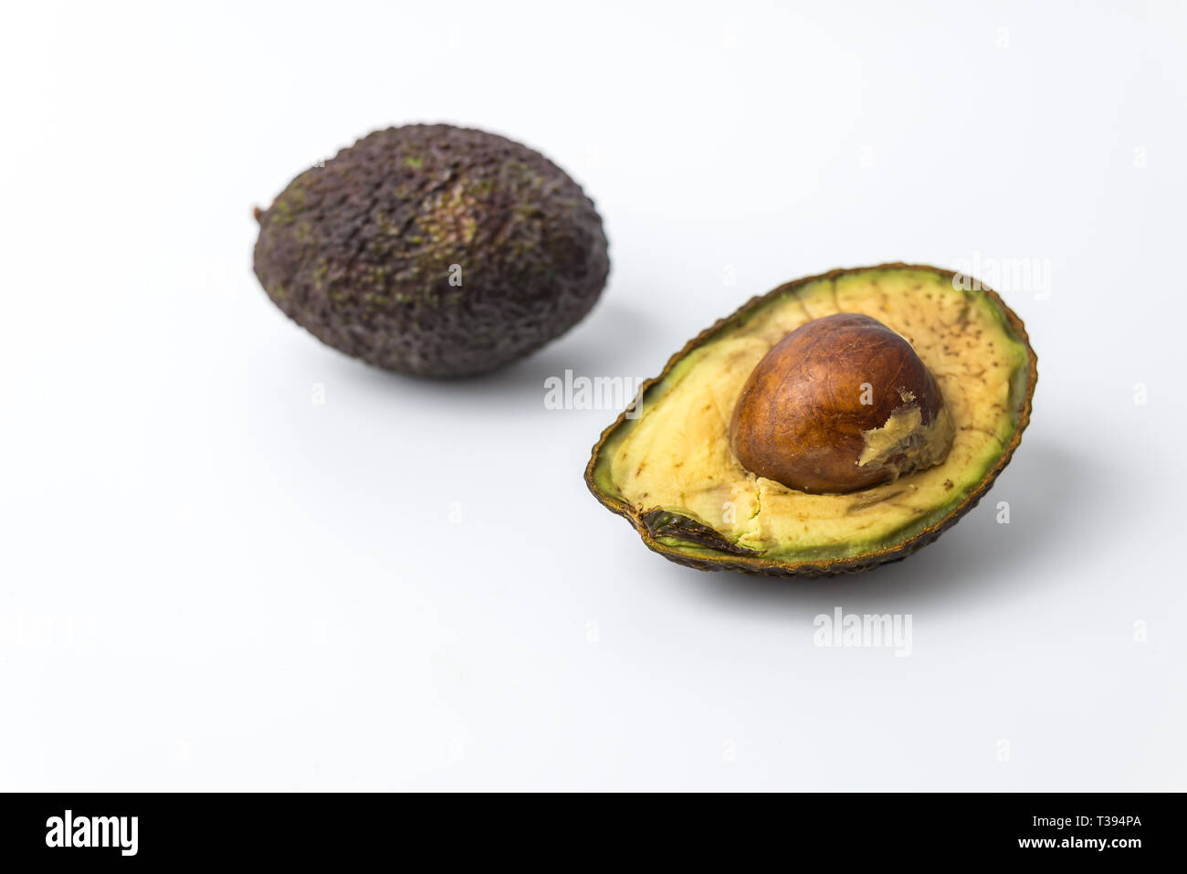 Trendy ugly organic avocado on white background Stock Photo - Alamy