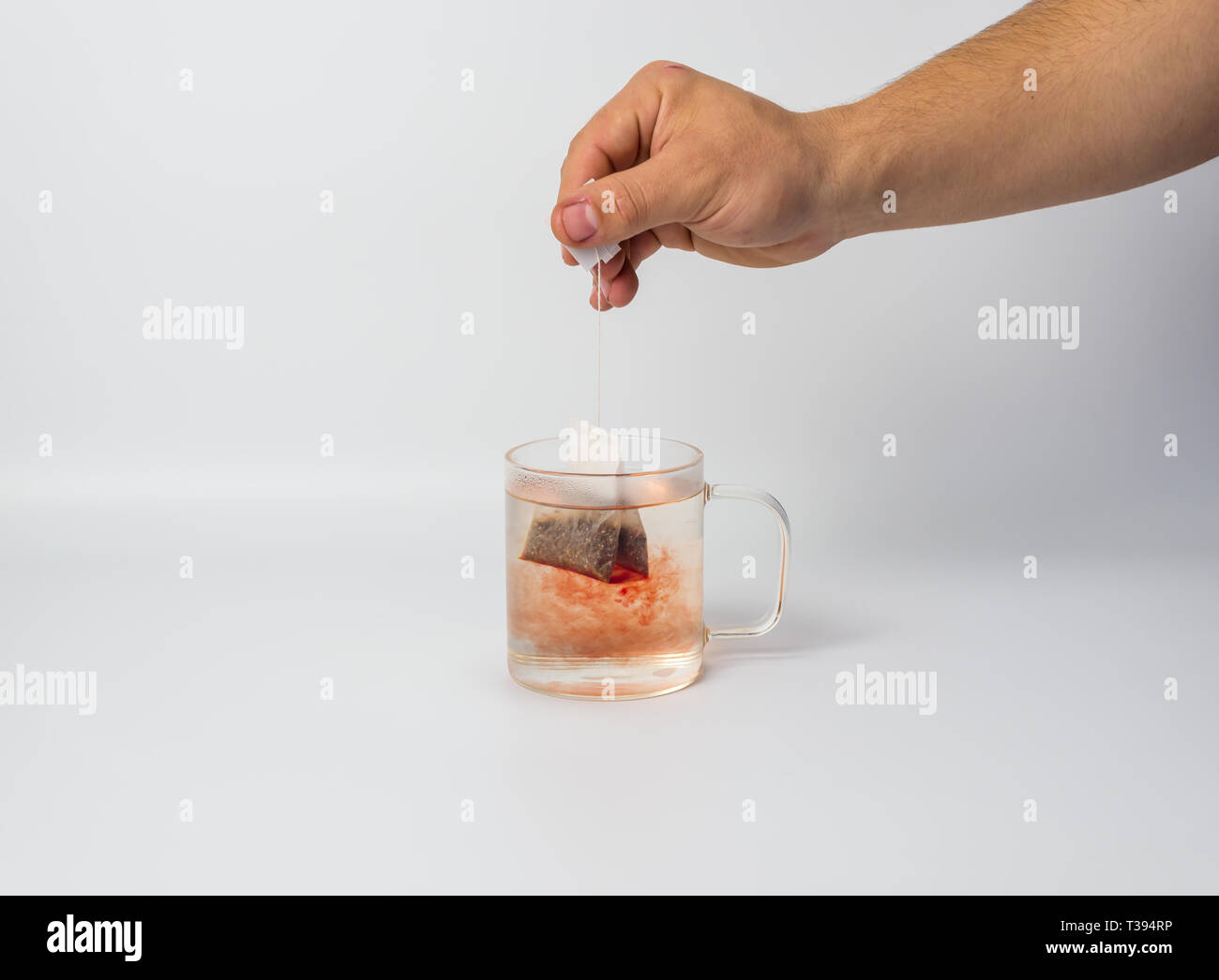 Hand tea bag hi-res stock photography and images - Alamy