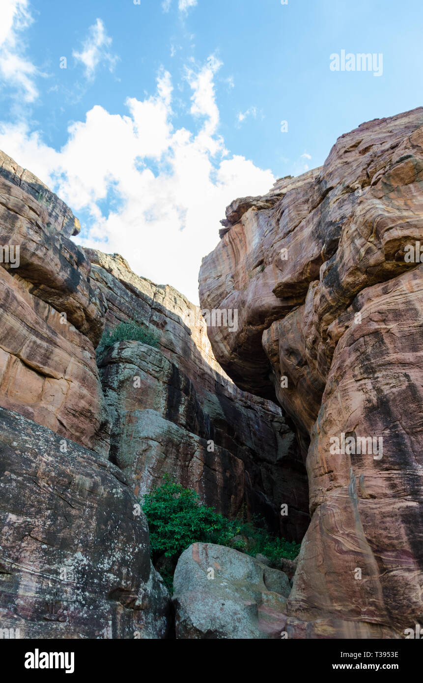 Badami's red sand stone cliffs and their horizontal crack systems which ...