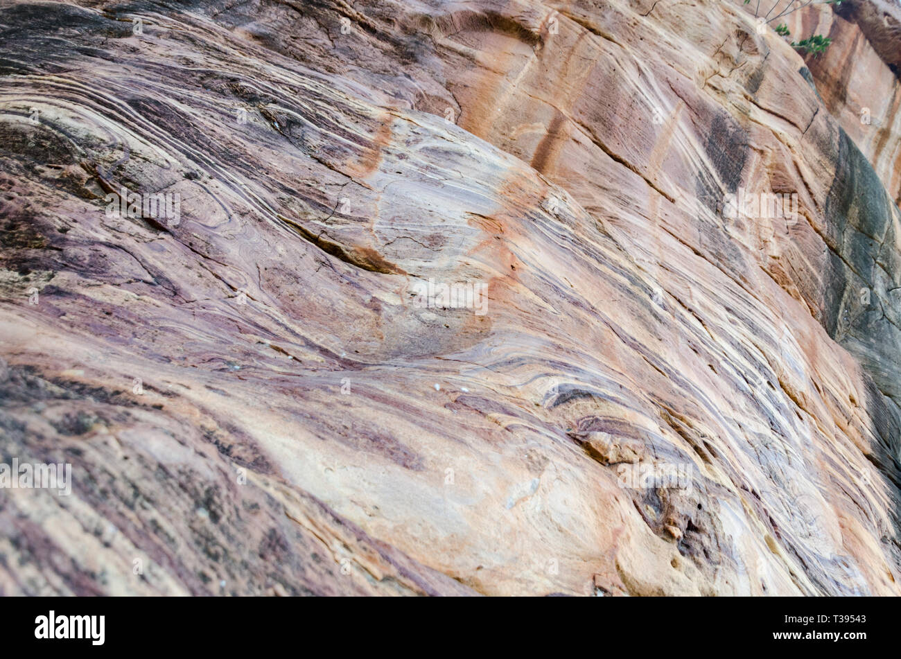 Badami's red sand stone cliffs and their horizontal crack systems which ...