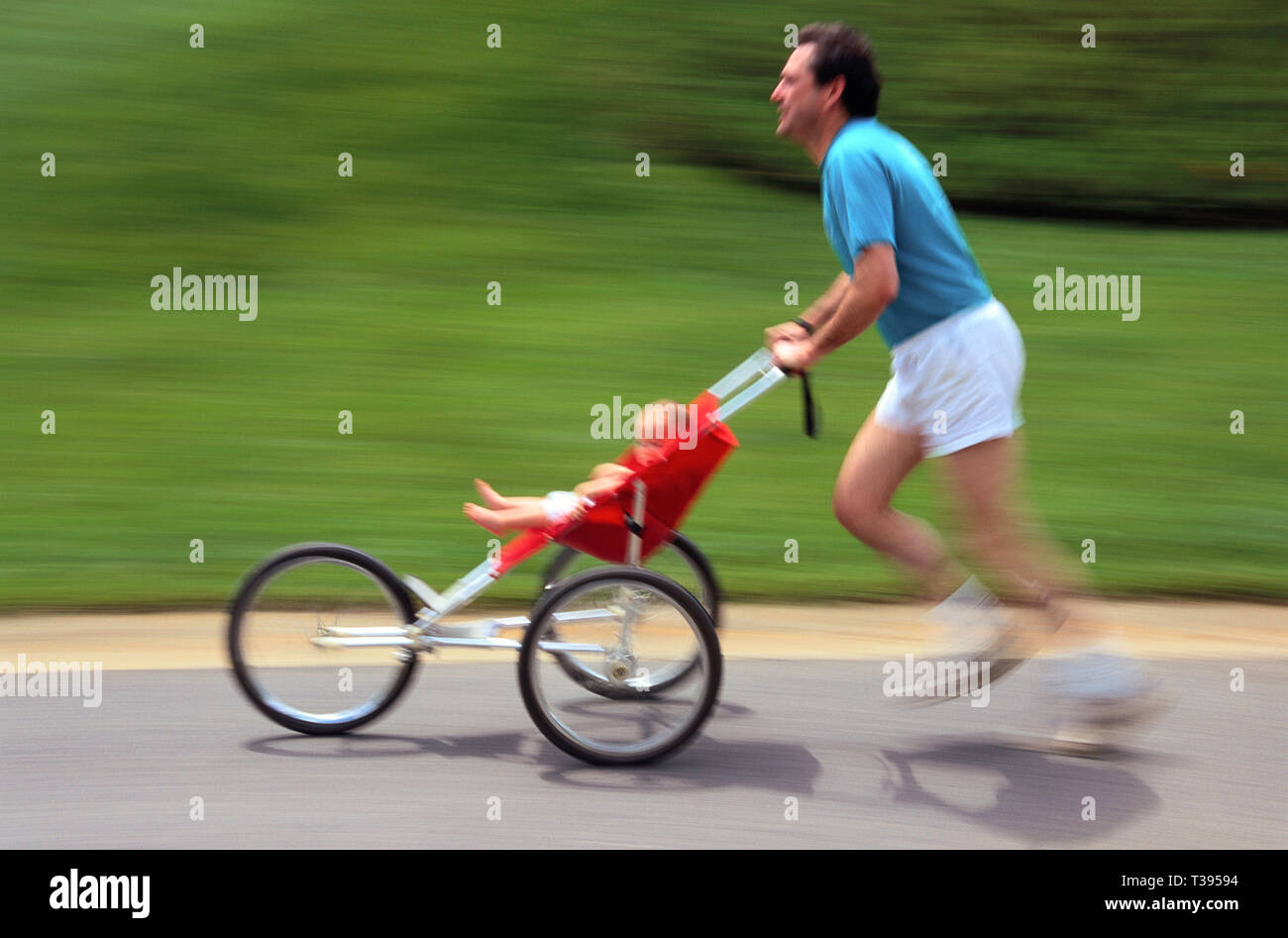 Father Jogging with his baby daughter in stroller, USA 1992 Stock Photo ...