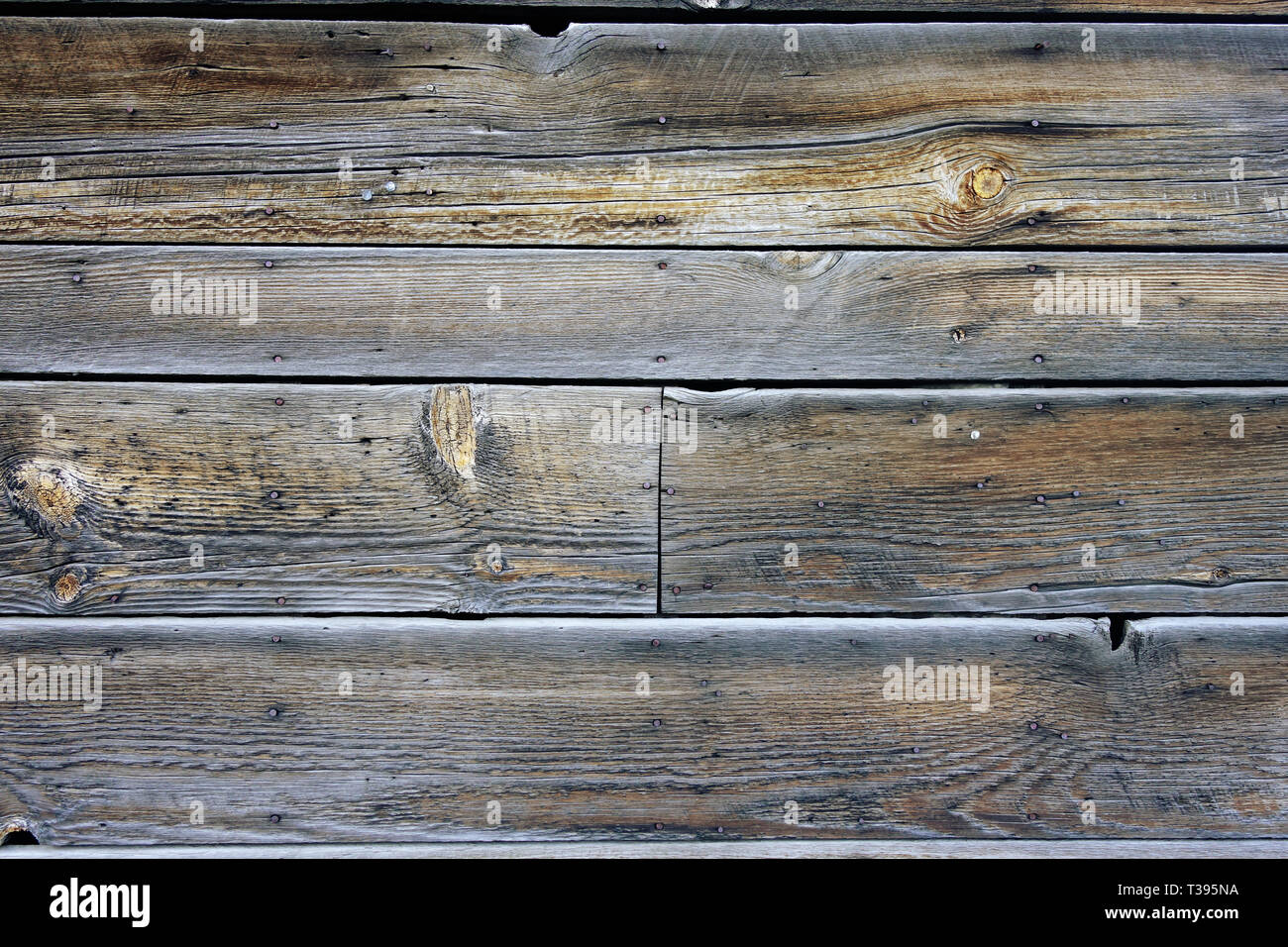 Old discolored wood siding on an exterior wall of a building Stock ...