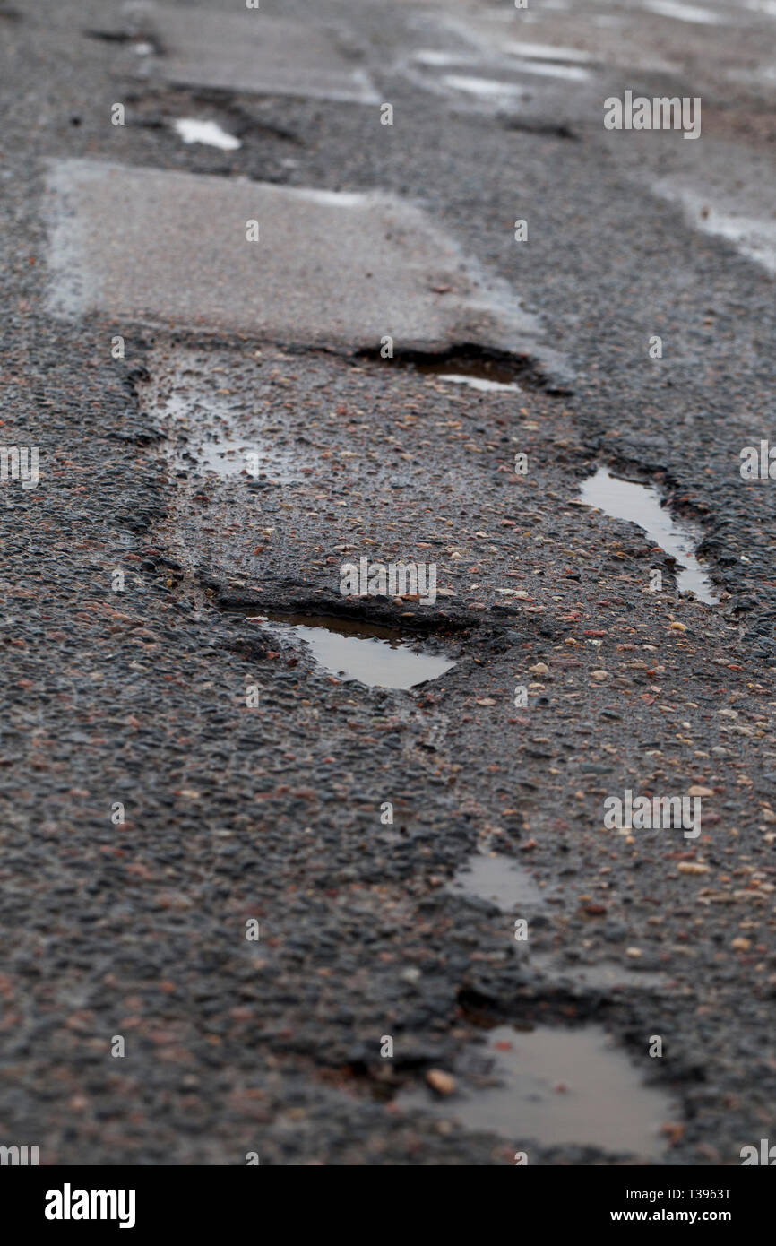 close-up photograph of a part of the highway, asphalt on which there ...