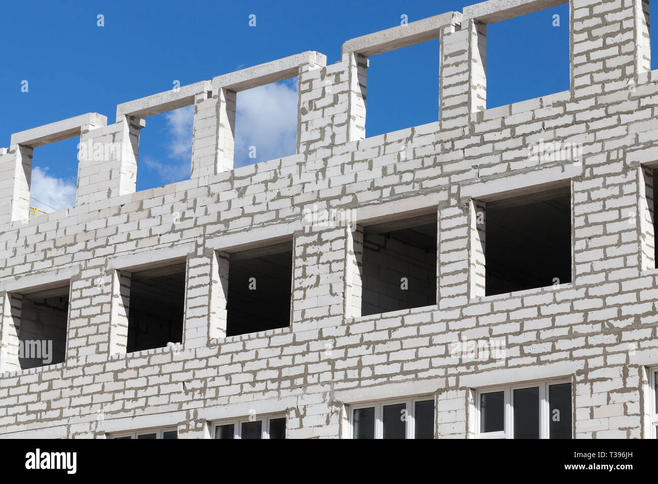 unfinished part of the building Of a large number of white bricks and ...
