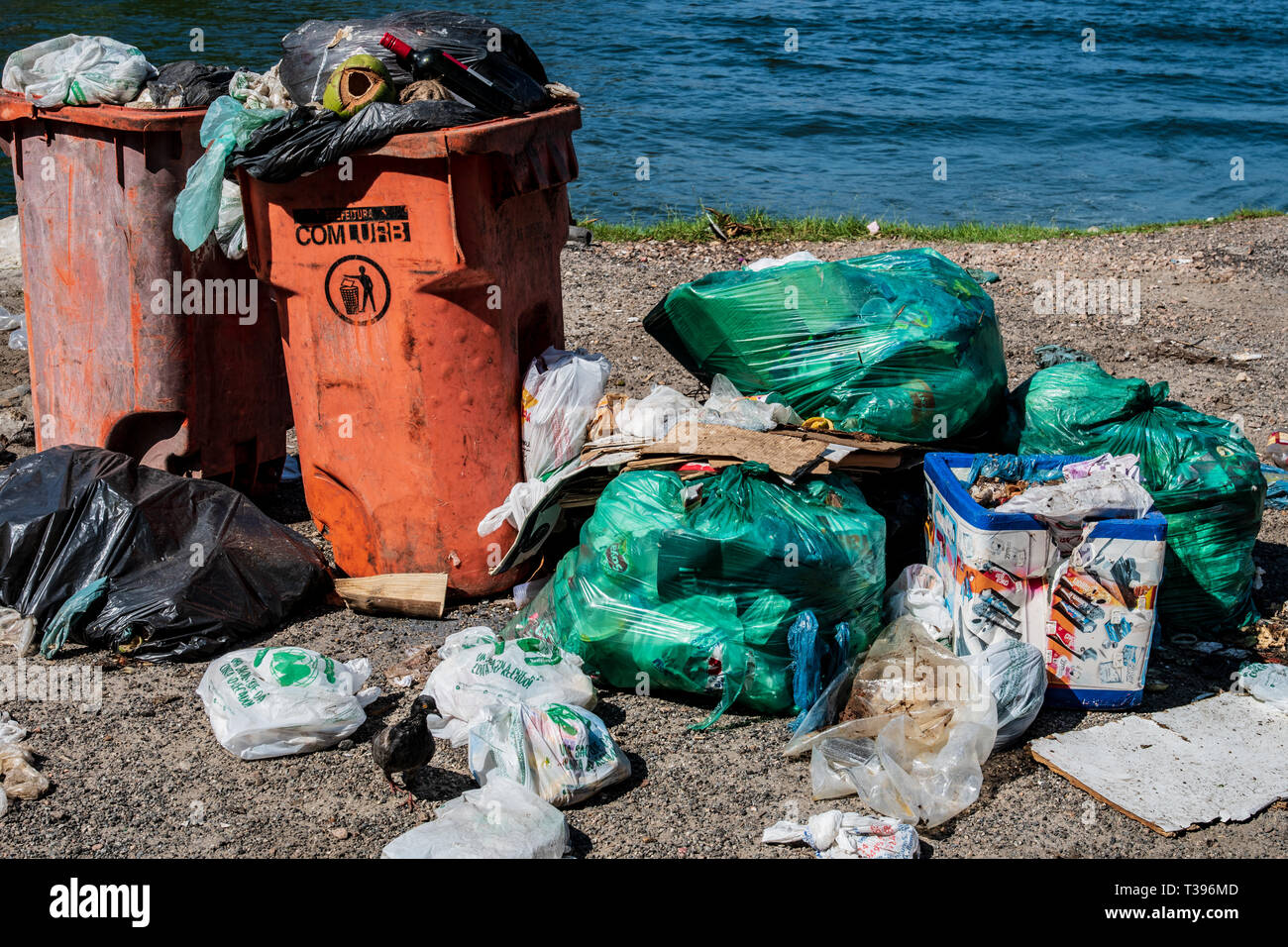 trash polluting the world Stock Photo - Alamy