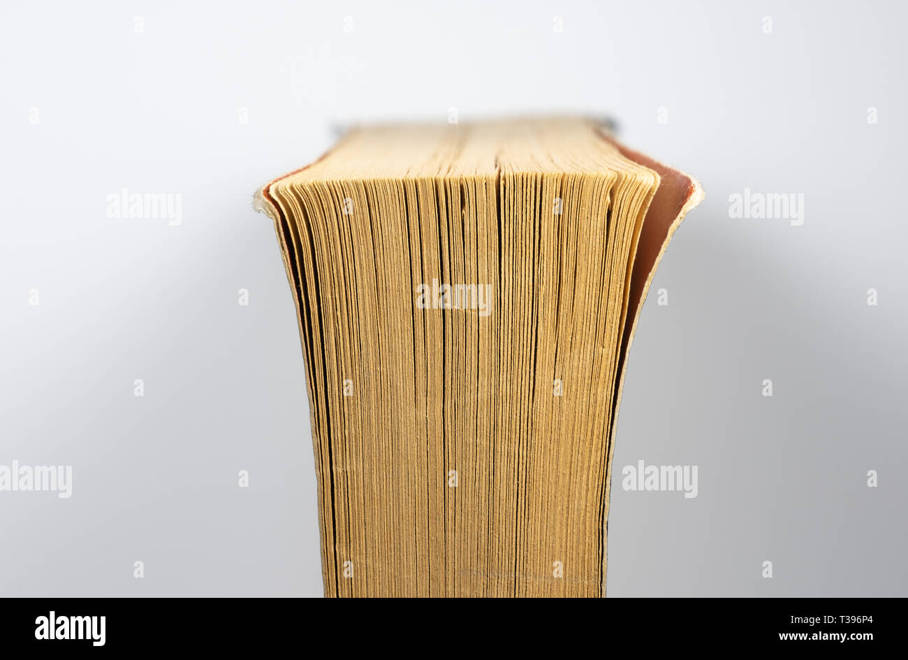 Close up image of worn corner of pages of a book Stock Photo - Alamy