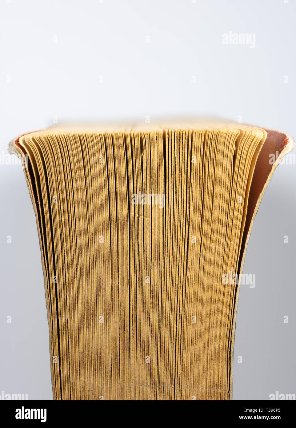 Close up image of worn corner of pages of a book Stock Photo - Alamy