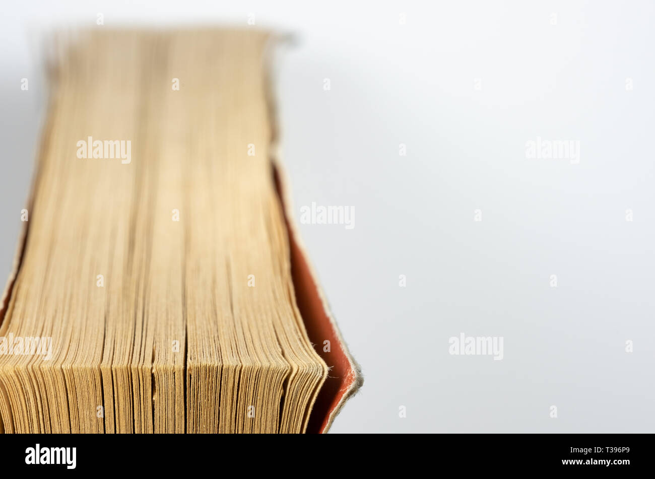 Close up image of worn corner of pages of a book Stock Photo - Alamy
