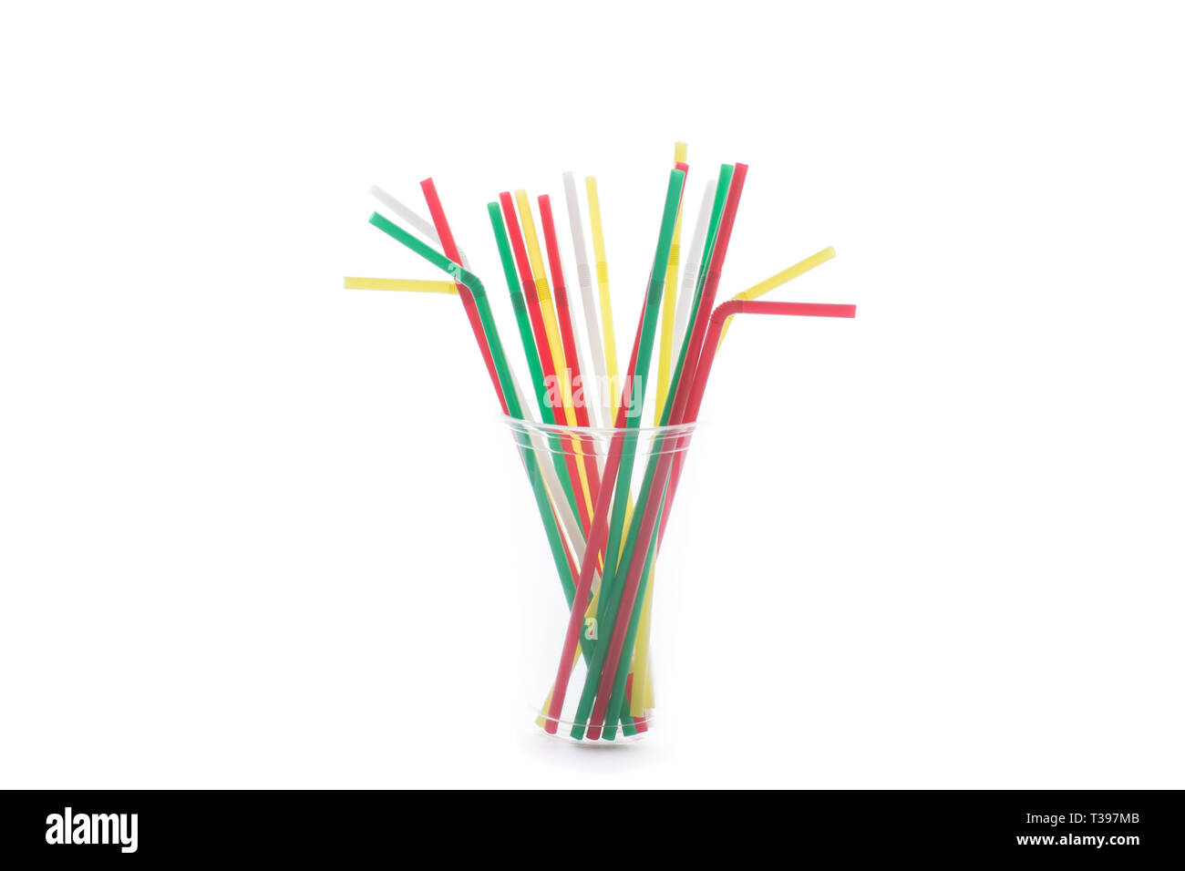 Transparent cup with colorful plastic straws isolated on the white ...