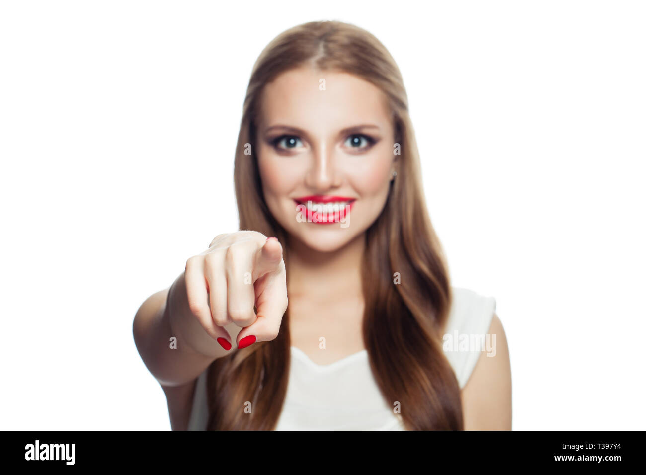Pointing finger. Female model pointing isolated on white background ...