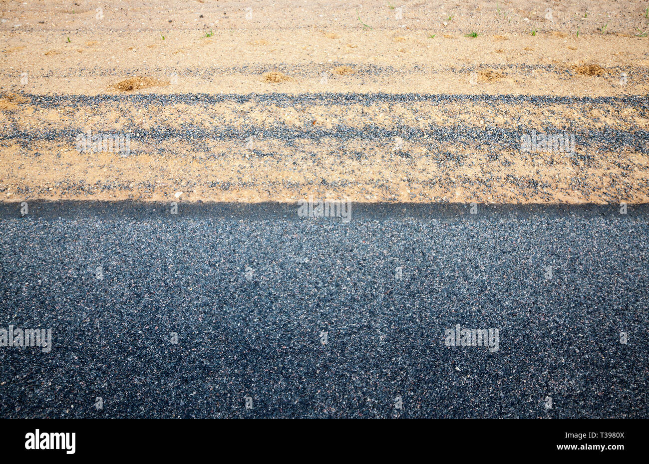 The edge of the asphalt road with the side of the road in asphalt, The ...