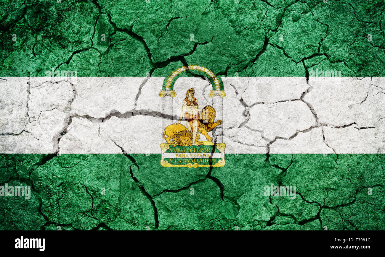 Andalusia flag, autonomous community in southern Spain, on dry earth ...