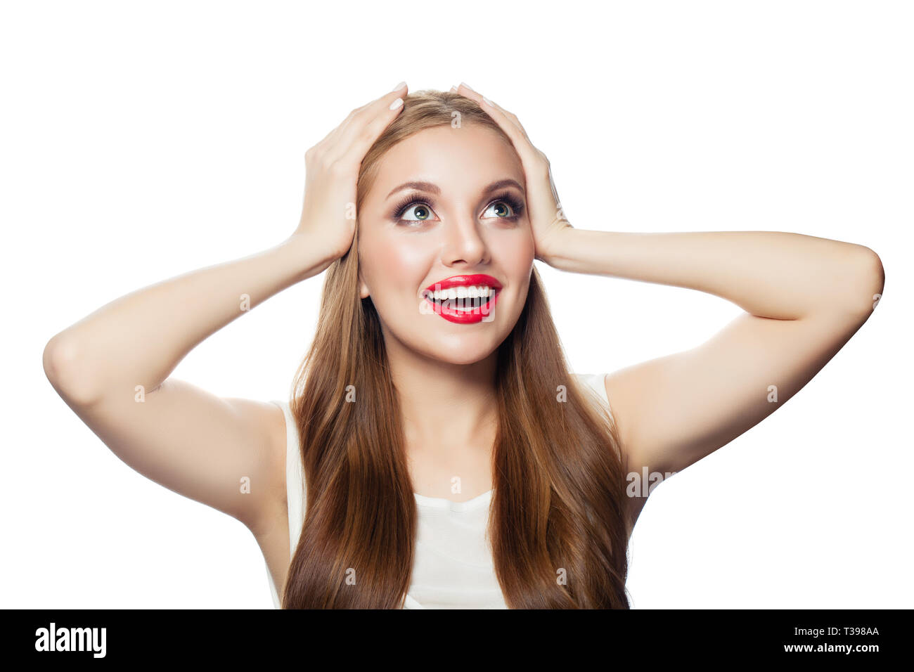 Happy surprised woman looking up isolated on white background Stock ...