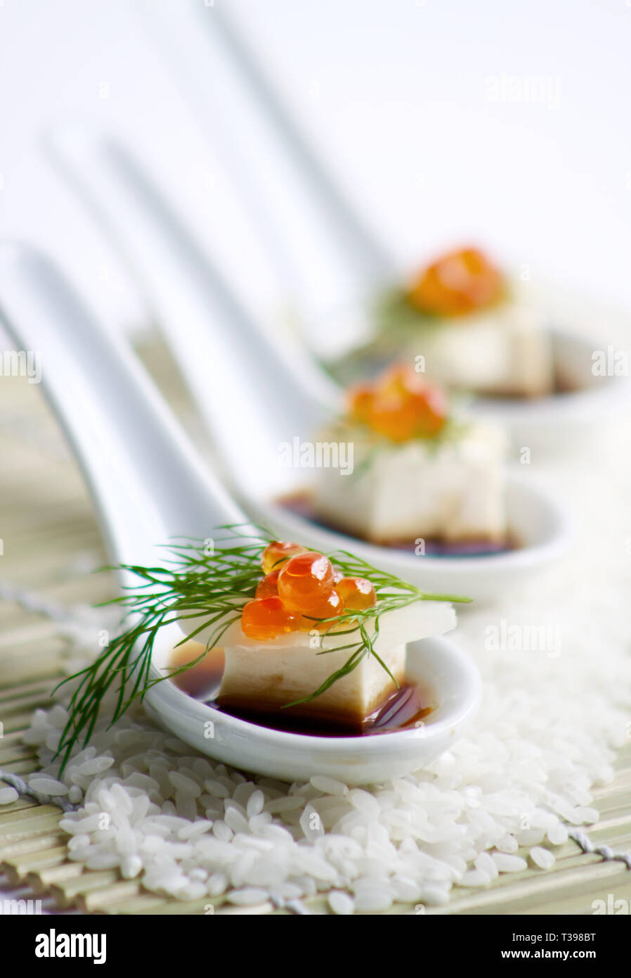 Chinese spoons with tofu Stock Photo - Alamy