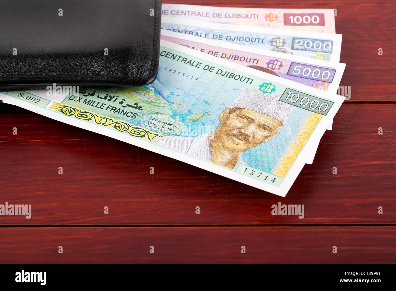 Djiboutian franc in the black wallet Stock Photo - Alamy