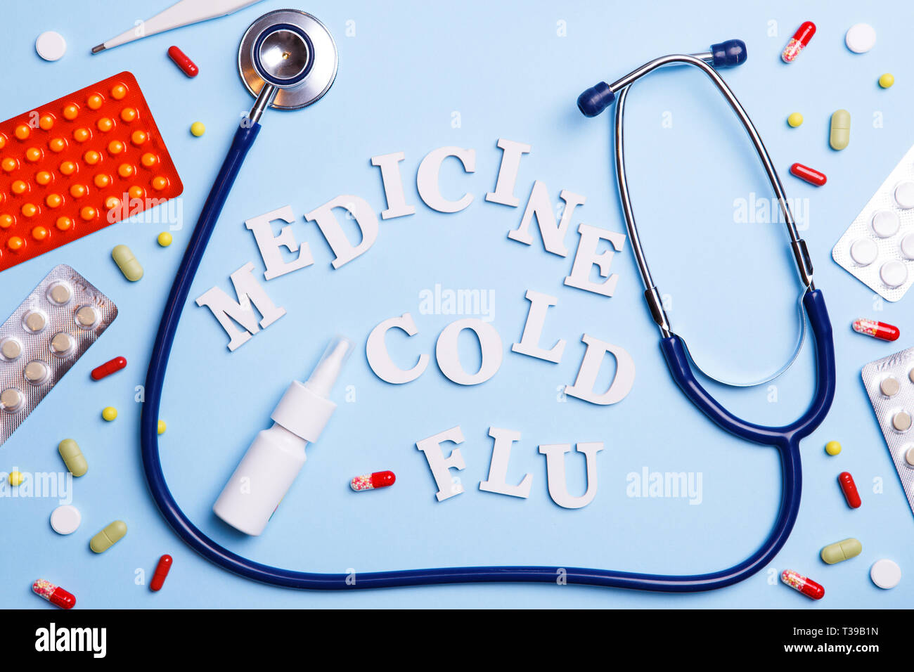 Cold medicine, thermometer, phonendoscope and words: medicine, cold ...