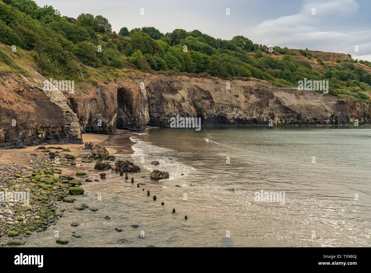 Beach and cliffs in Sandsend, North Yorkshire, England, UK Stock Photo ...
