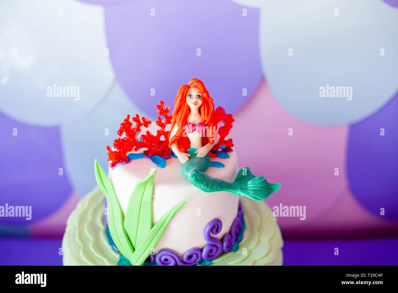 Mermaid theme cake with colorful glitter tails, shells and sea ...