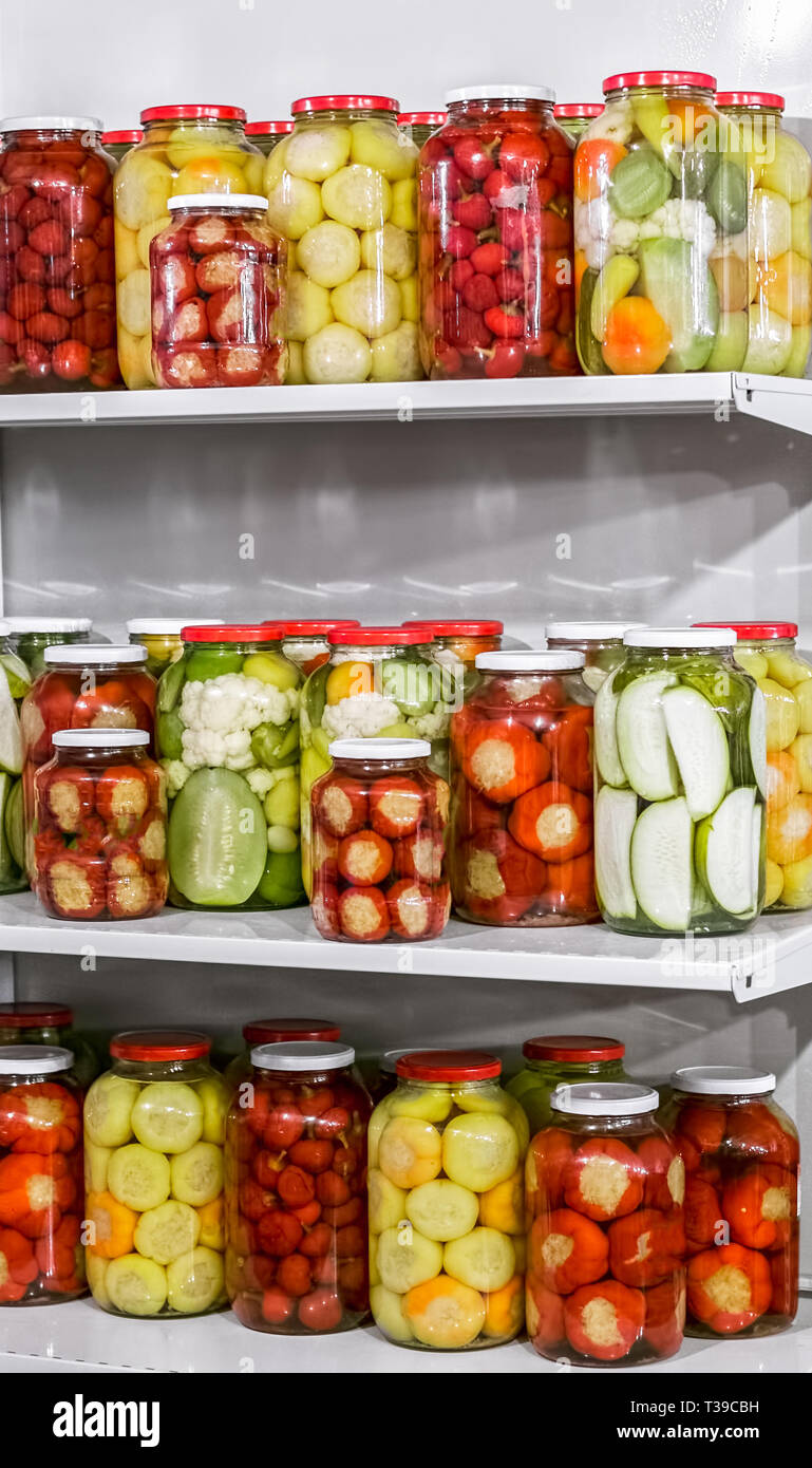 Traditional Romanian pickles of various fruits and vegetables on the ...