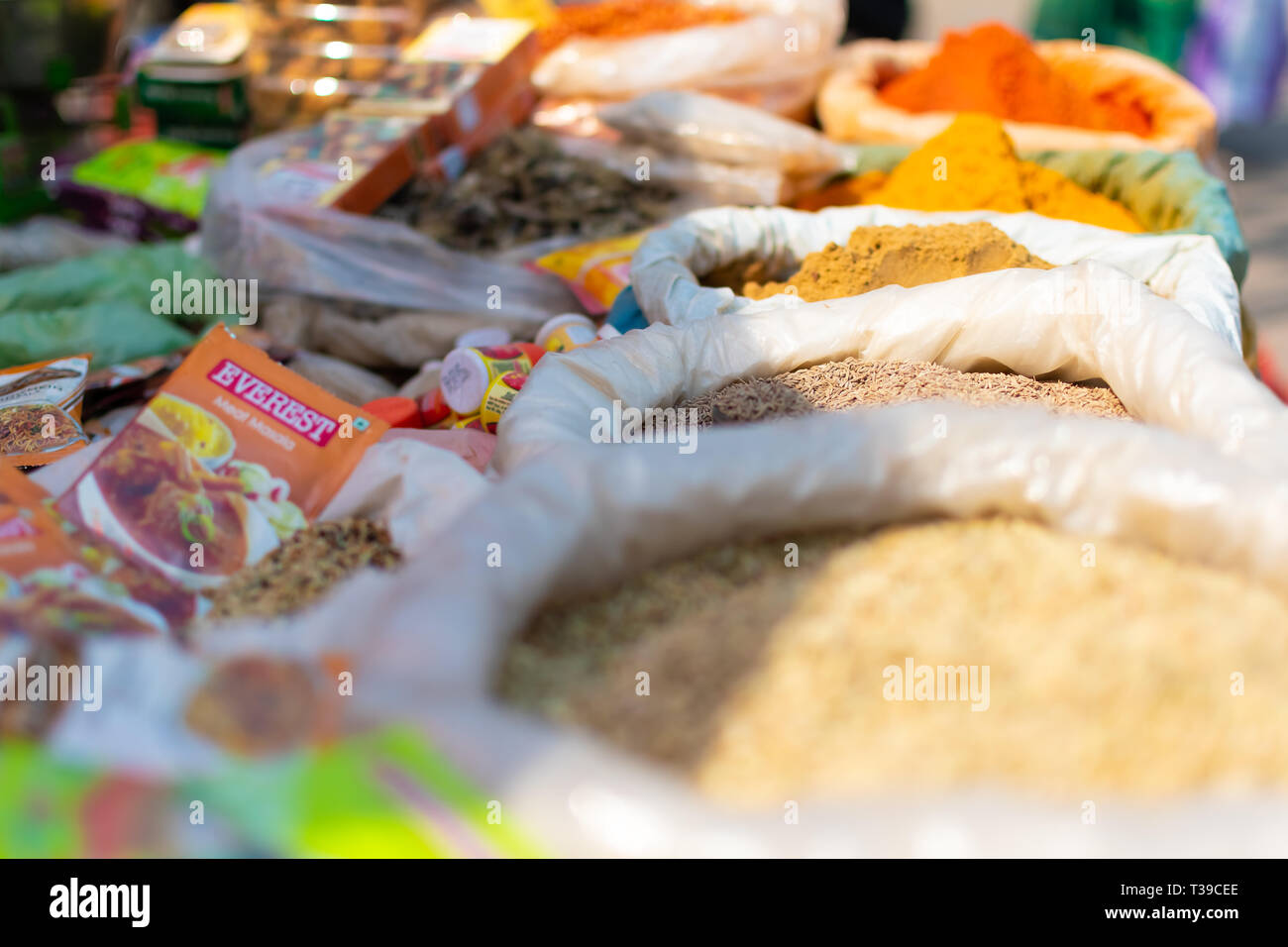 Varanasi, India, Mar 10 2019 - Colorful curry a pepper spices powders ...