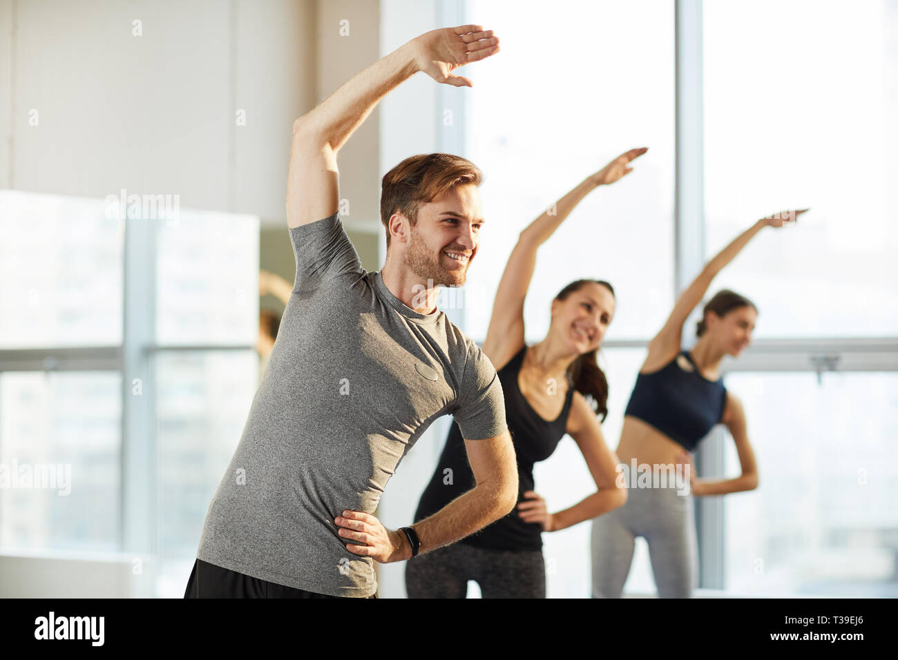 General yoga class for men and women Stock Photo - Alamy