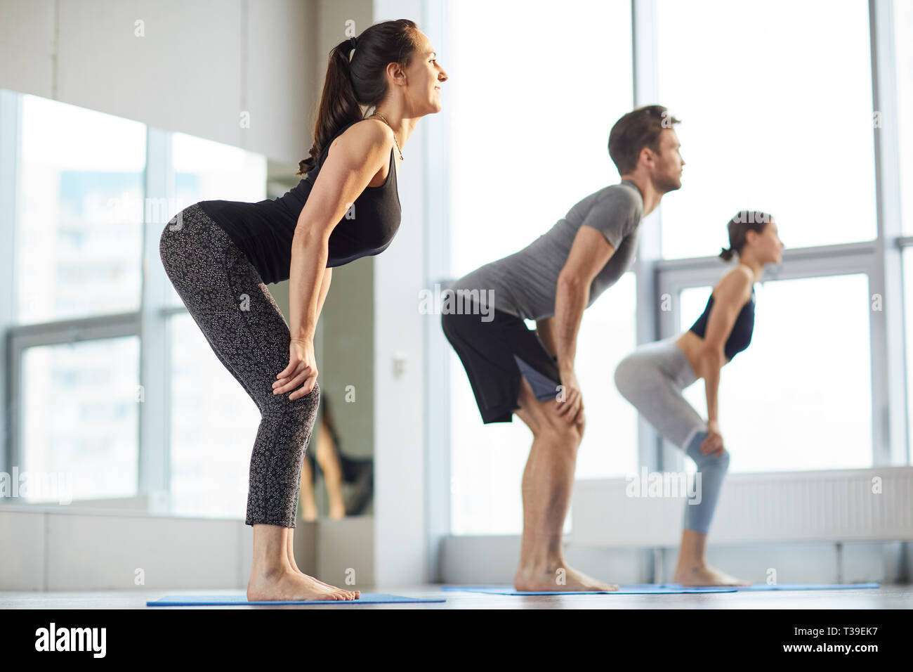 Yoga students practicing back exercise Stock Photo - Alamy